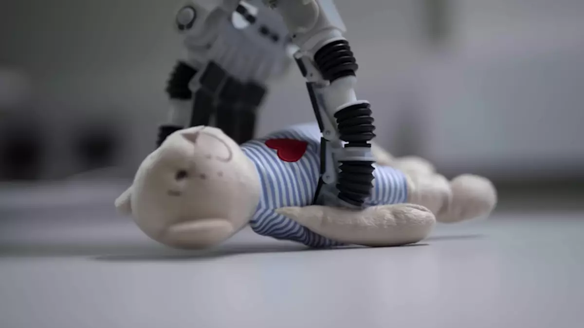 Braç robot Dyson recollint joguines