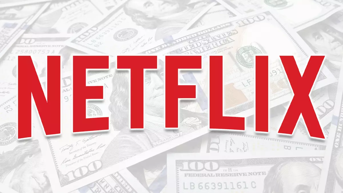 „Netflix“ logotipas virš pinigų krūvos.