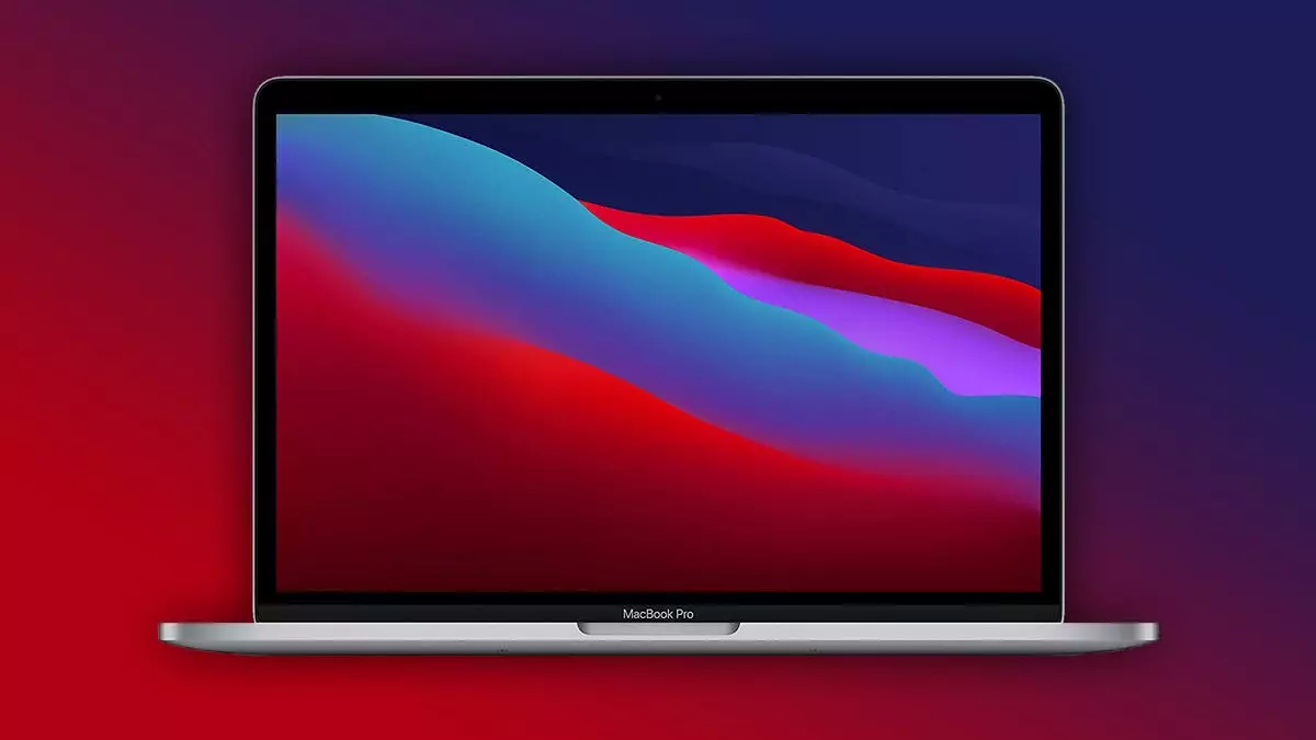 MacBook Pro punasel ja sinisel taustal.