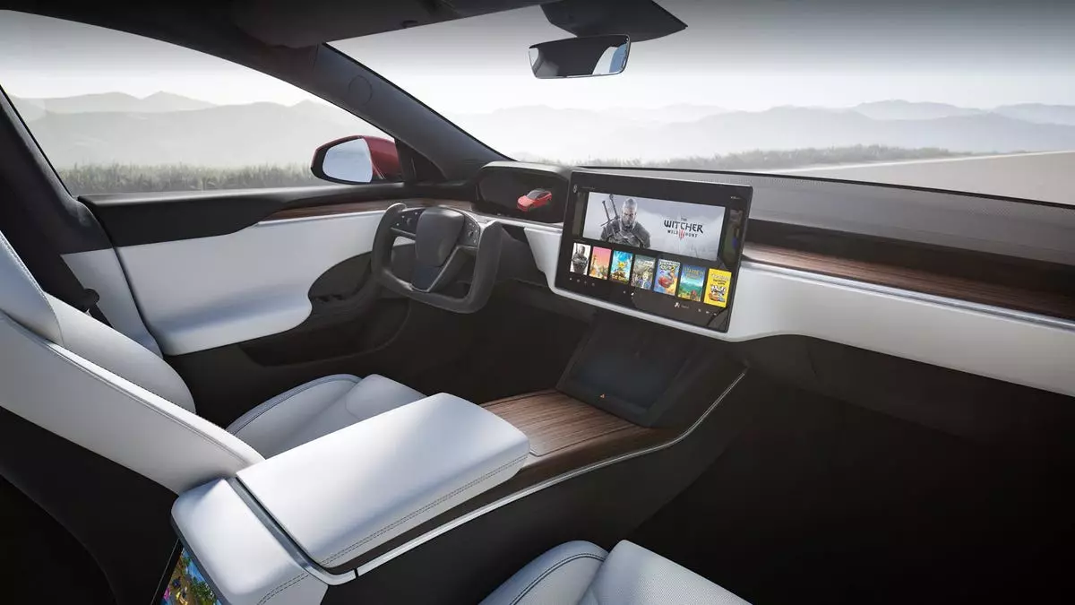 „Tesla Model S“ interjeras, kuriame informacijos ir pramogų sistemoje groja „The Witcher 3“.