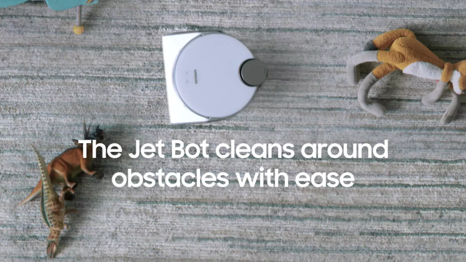 Jet Bot AI+ кілемдегі ойыншықтарды аралайды