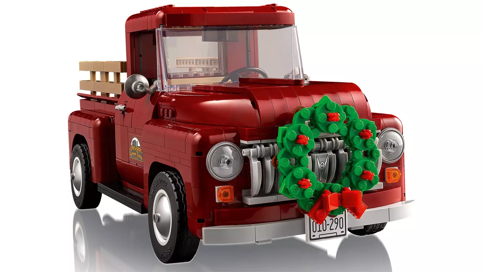 Camioneta LEGO con corona festiva en la parrilla delantera