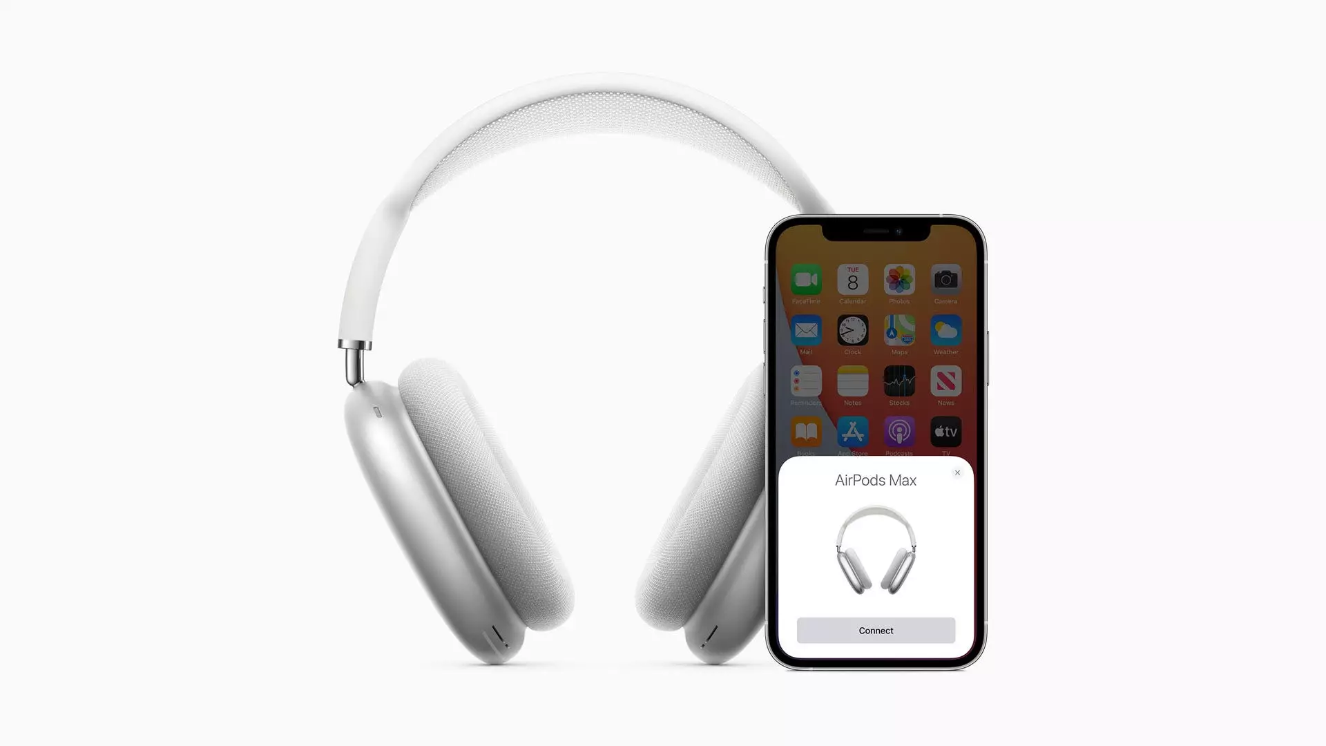 'n AirPods Max-koptelefoon langs 'n iPhone wat met die oorfone saambind.