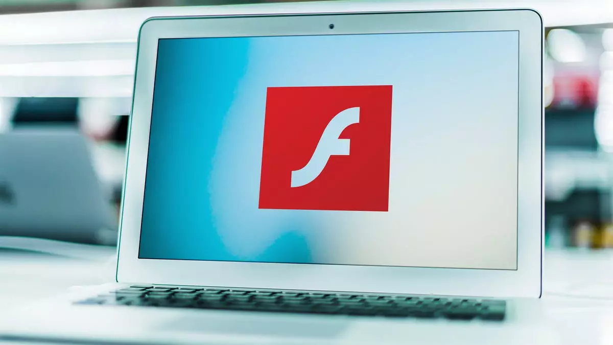 E Laptop mat dem Flash Logo um Bildschierm.