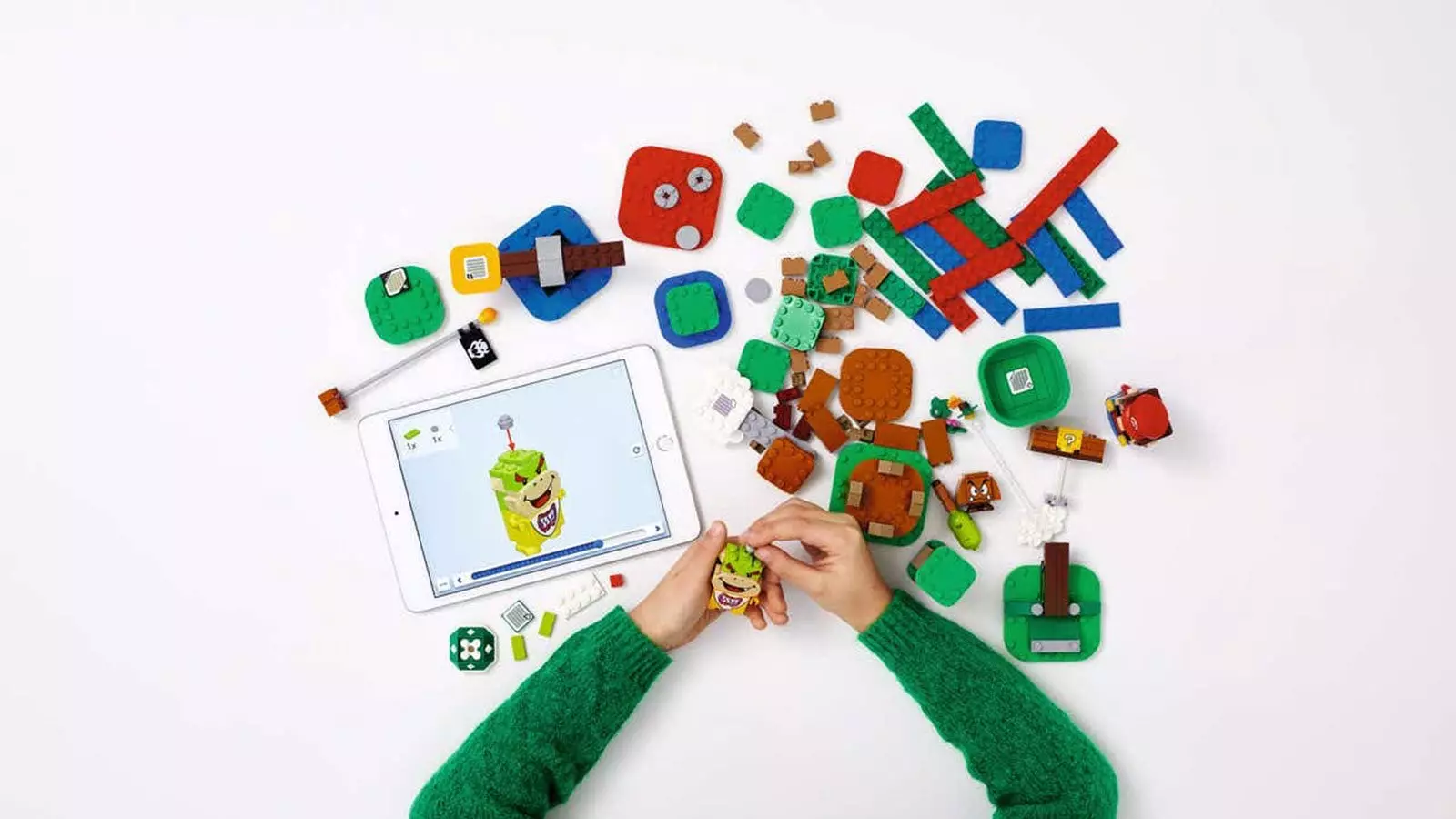 iPad egy befejezetlen LEGO készlethez tartozó utasításokkal.