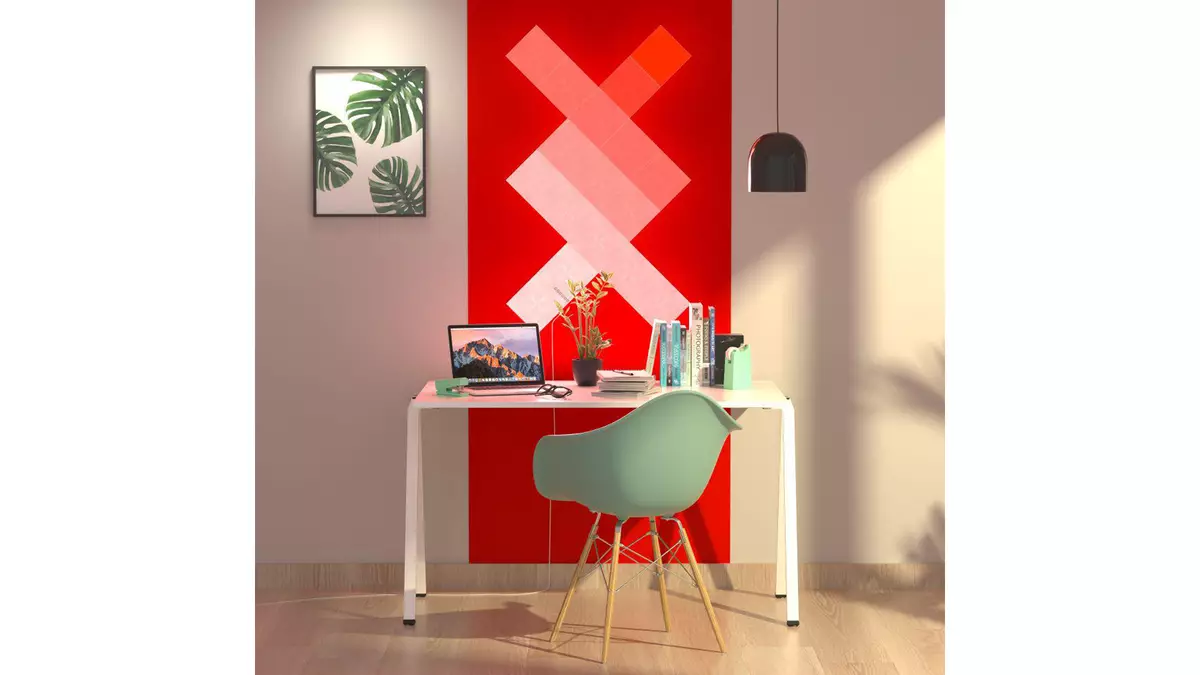 แผงไฟ Nanoleaf Canvas Smarter Kit จัดวางบนผนังสำนักงานบนพื้นหลังสีแดงในห้องที่มีโต๊ะและเก้าอี้