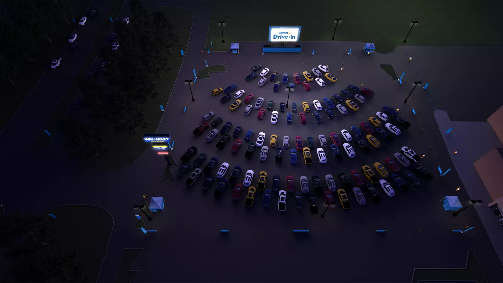 Avtomobili Walmart Drive-in izkušnje, parkirani na parkirišču ob gledanju filma