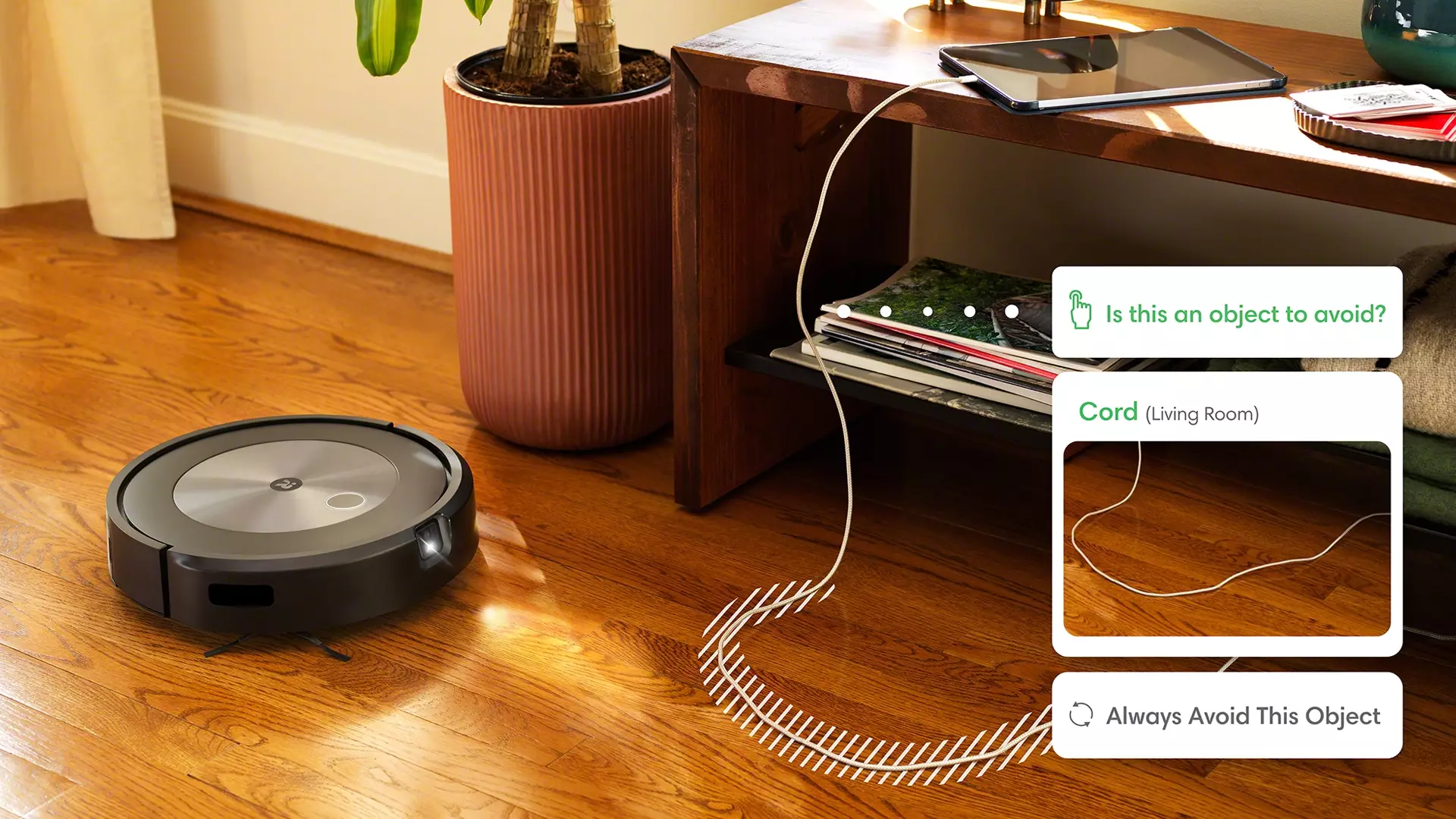 La Roomba J7 identigante kaj evitante elektran kablon