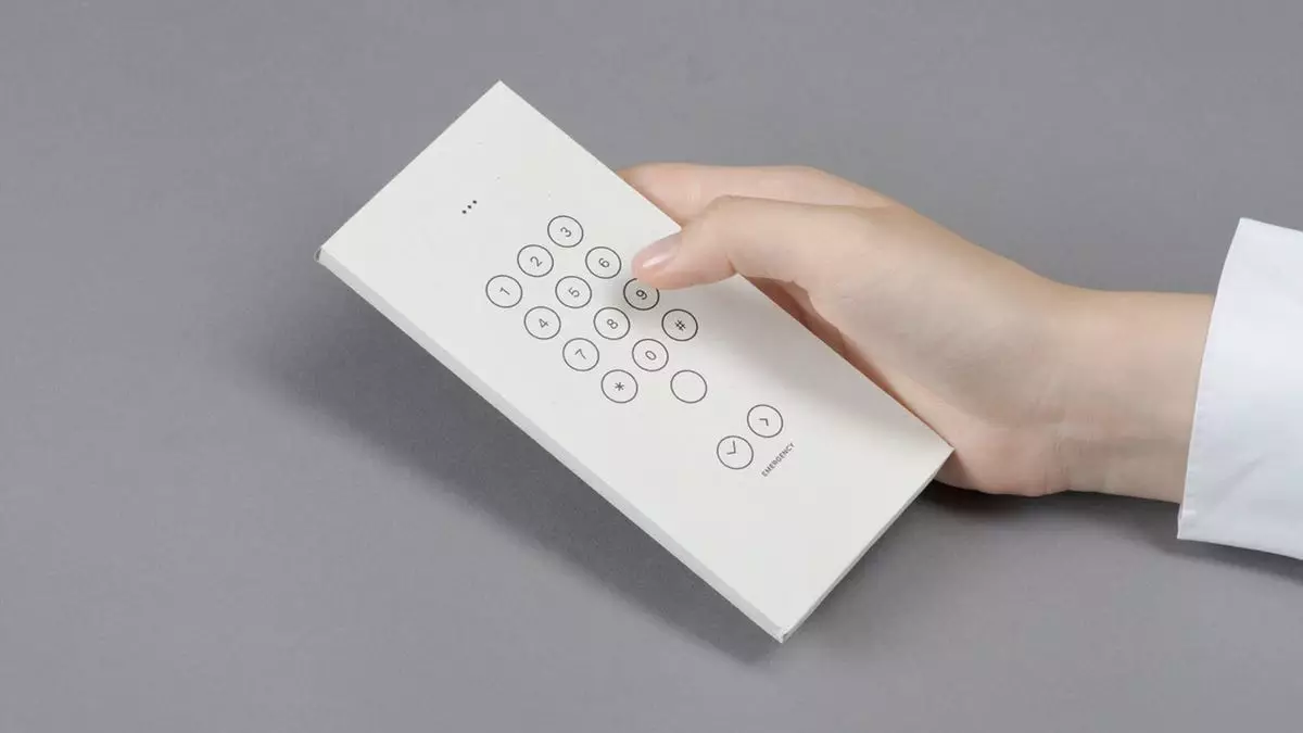 O bucată de hârtie în formă de telefon, cu un dialer de telefon imprimat pe față.
