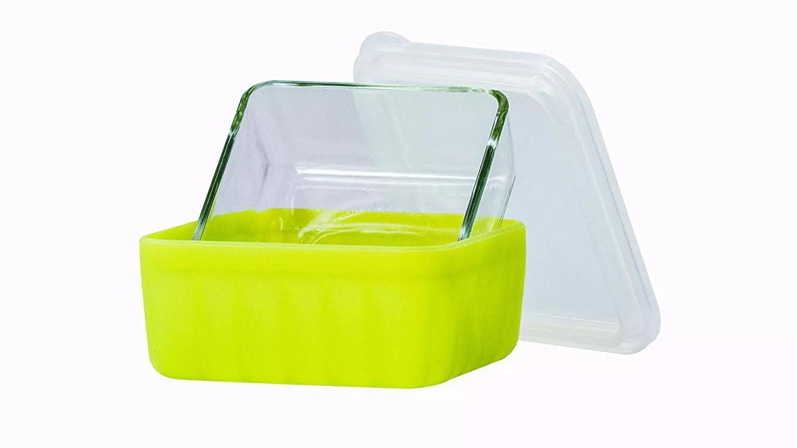 En limegrön matbehållare i glas från Frego som sitter uppe i sin silikonbehållare med locket vilande mot den.