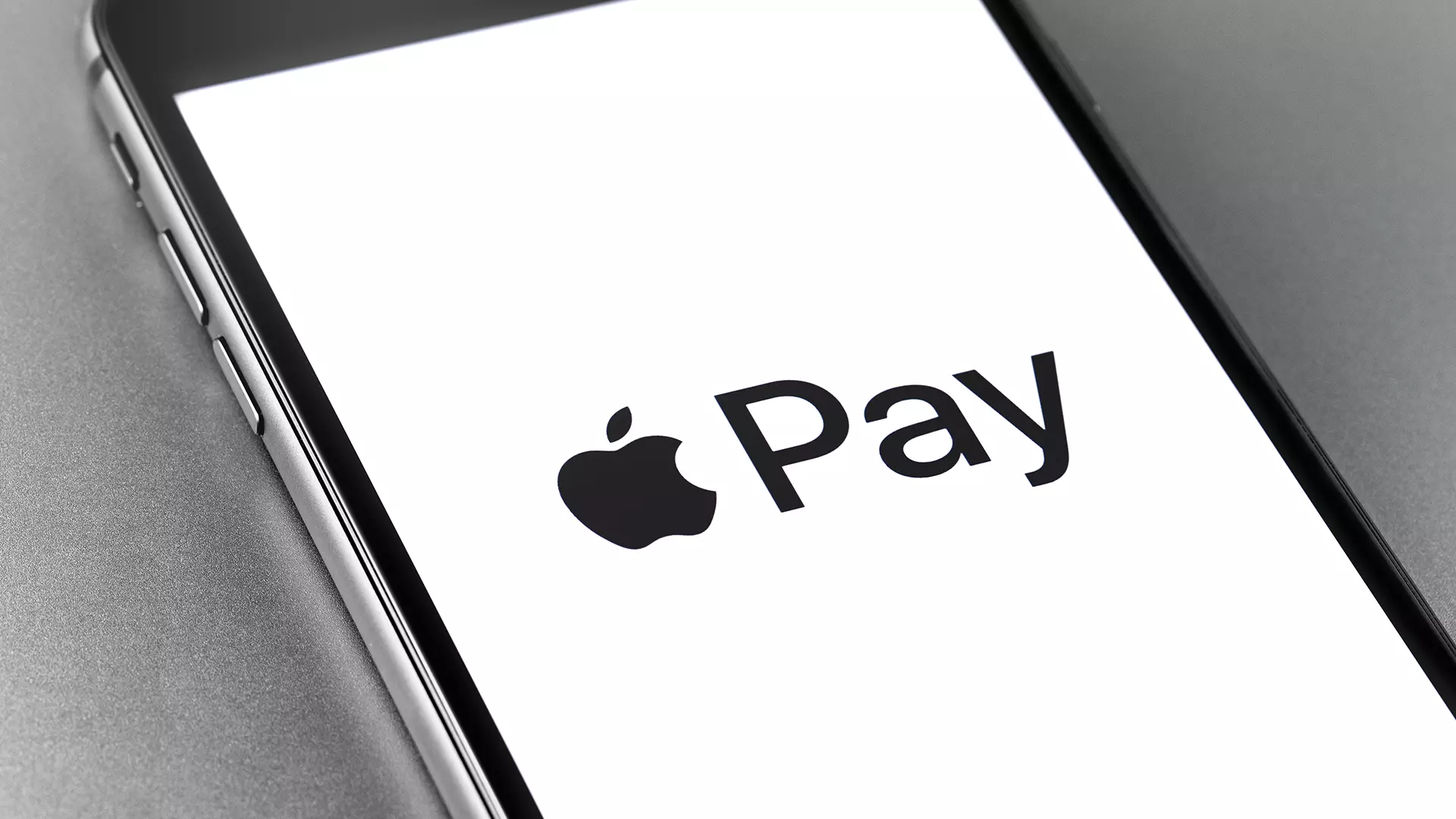 O logotipo de Apple Pay na pantalla do teléfono.